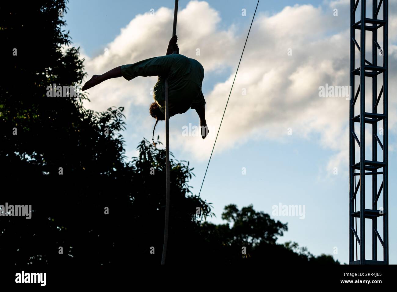 An acrobatic high wire act on the Back of Beyond Stage at Green Man ...