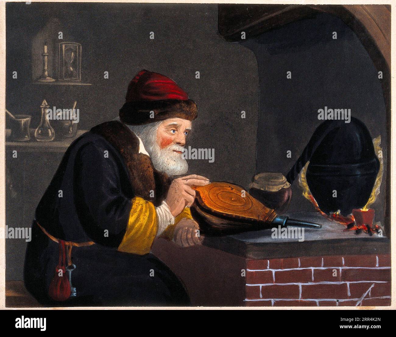 An alchemist at his furnace, hunched over bellows, coloured mezzotint ...