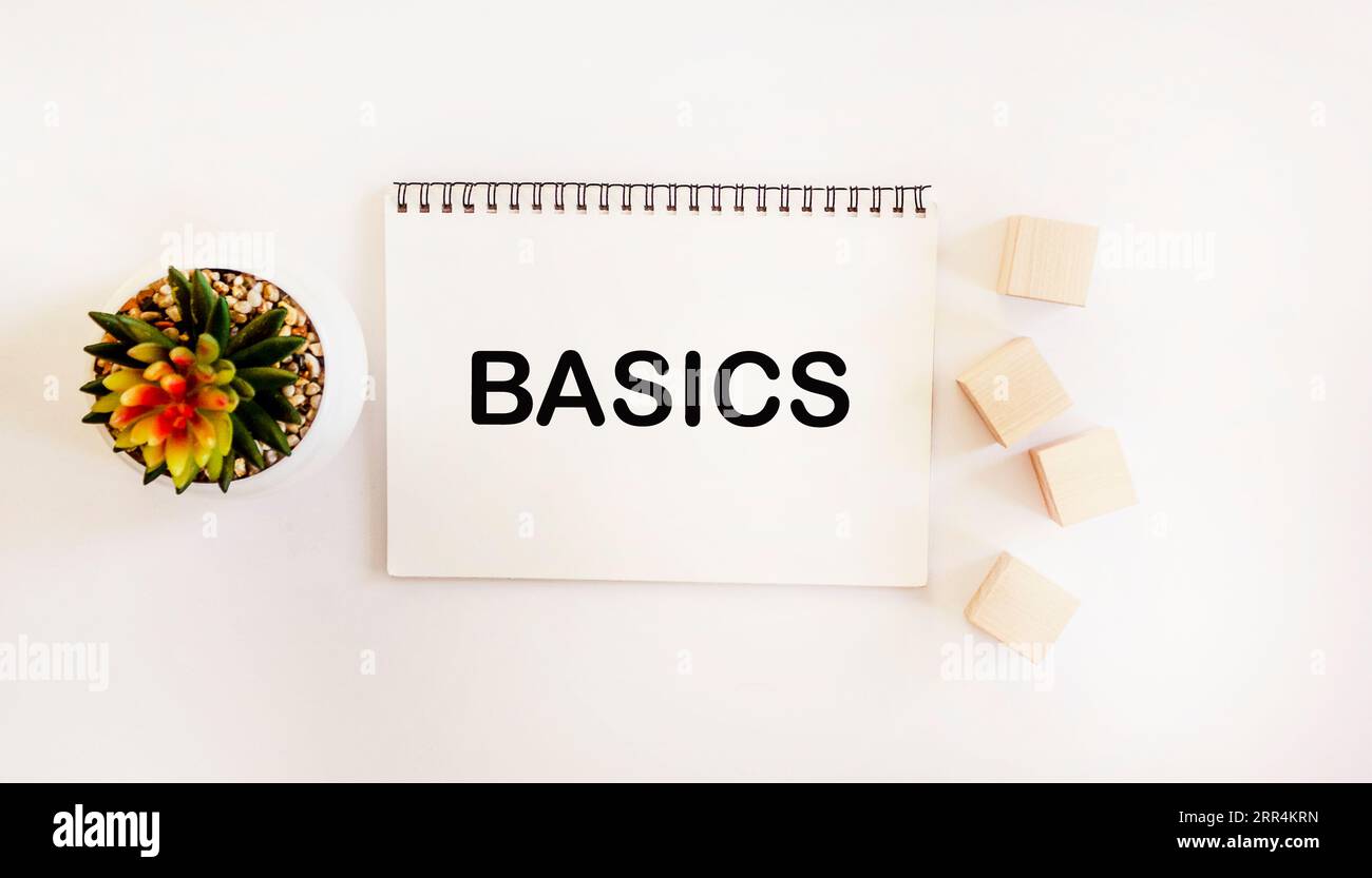 The word BASICS written on a notepad and white background Stock Photo ...