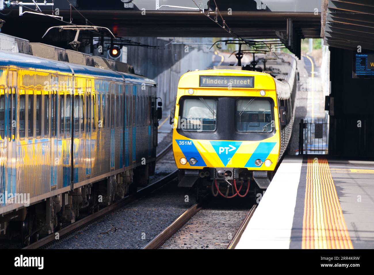 Public transport Melbourne showing an electric passenger train pulling into a suburban train ...