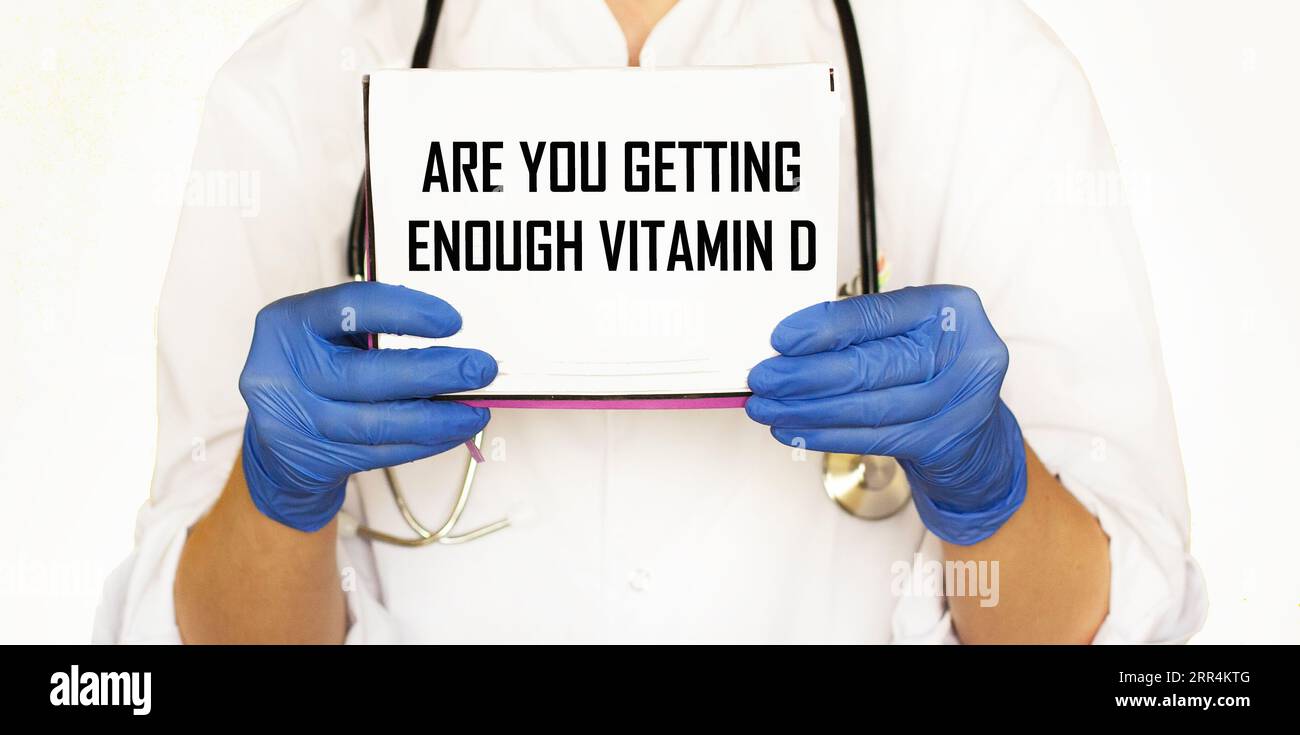 Are you getting enough vitamin D text on white paper is held by a ...