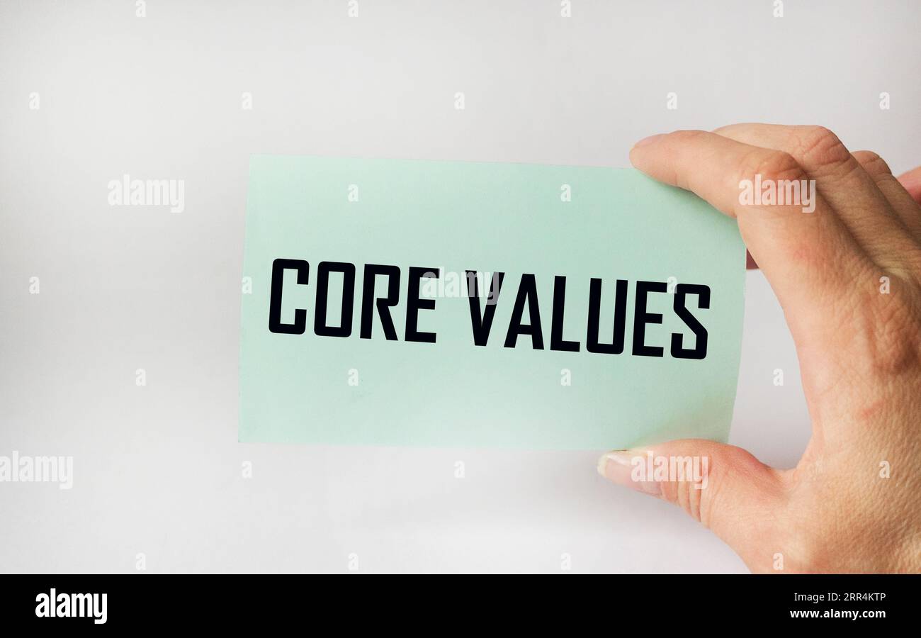 Text Core Values on a colored sticker in a mans hand, copy space Stock ...