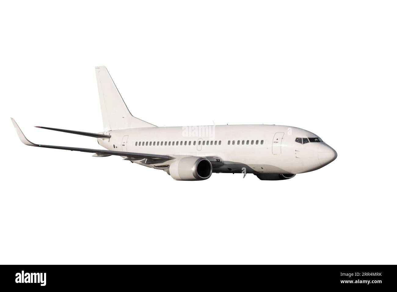 Passenger jet plane flies isolated on white background Stock Photo - Alamy