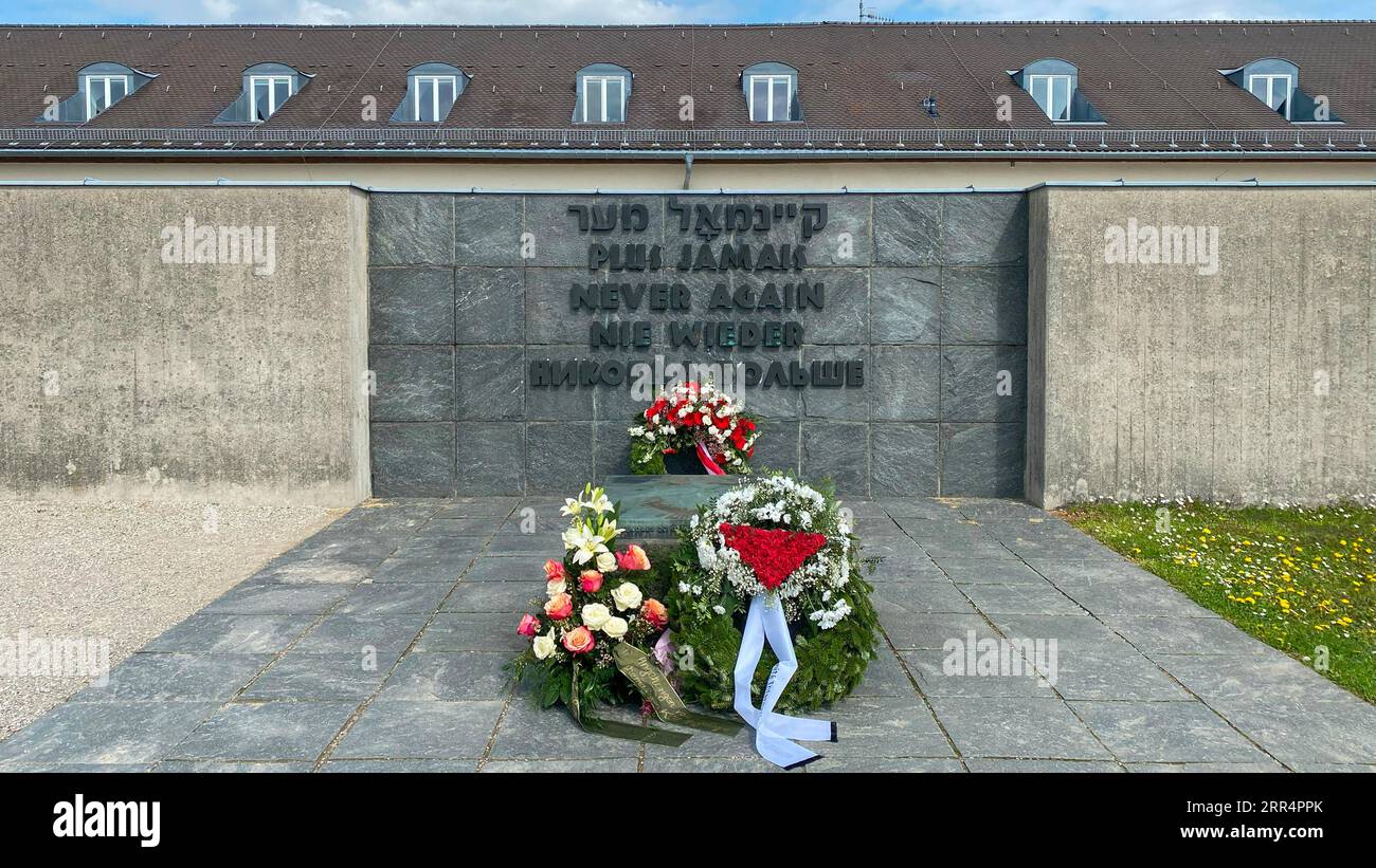 Never Again in five languages on the Unknown Prisoner memorial at the ...
