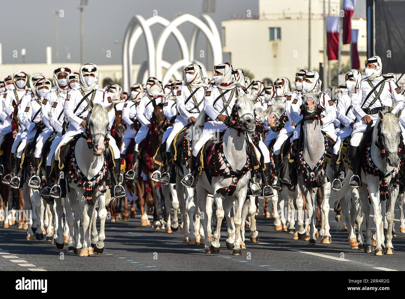 201211 -- DOHA, Dec. 11, 2020 -- Qatari police officers participate in ...