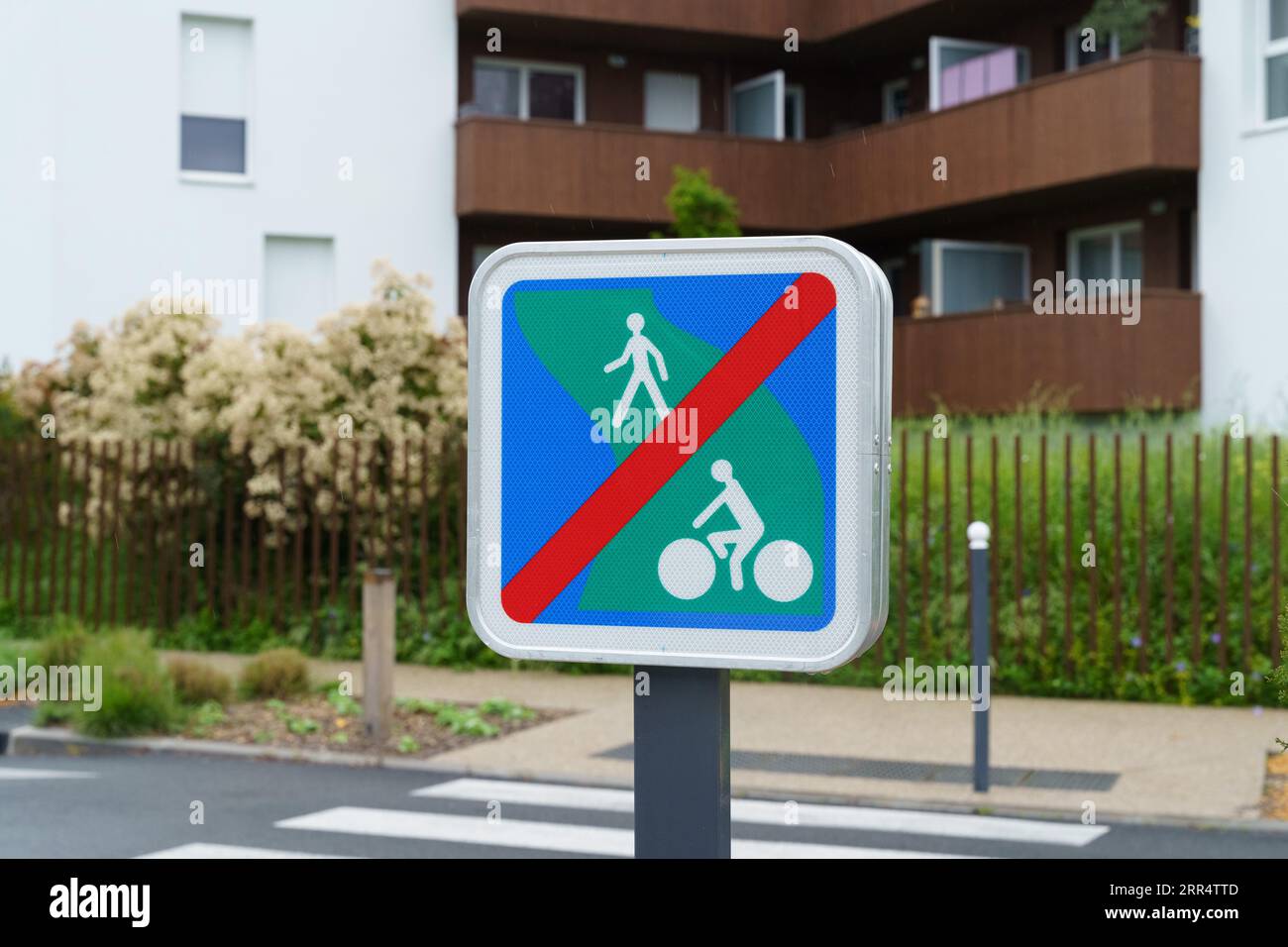 Road sign - the end of a green road in a residential area, set in front ...