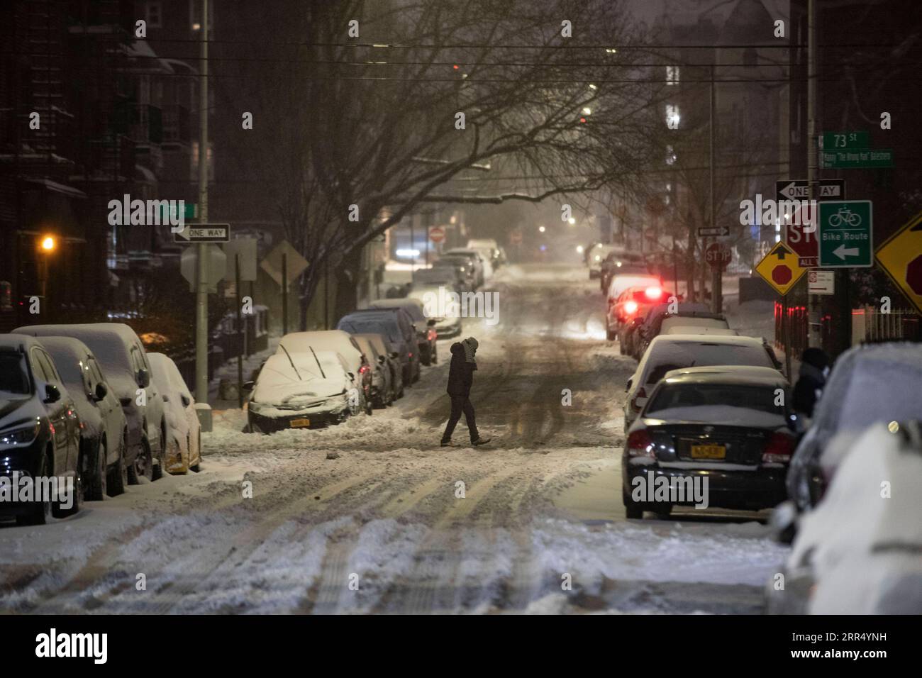 201217 -- NEW YORK, Dec. 17, 2020 -- A pedestrian walks on a snow ...