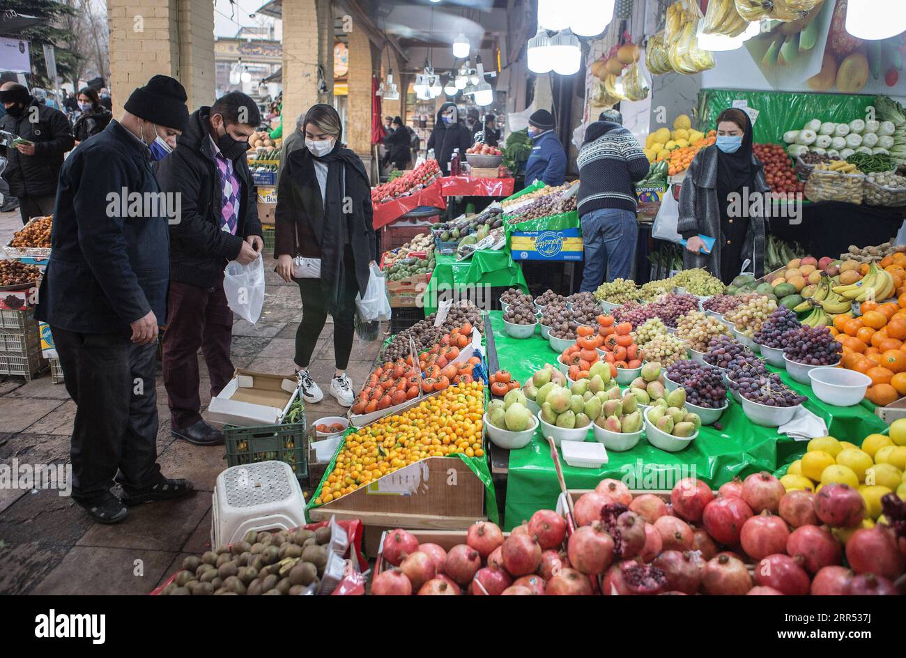 201220 -- TEHRAN, Dec. 20, 2020 -- People shop for Yalda Night at an ...