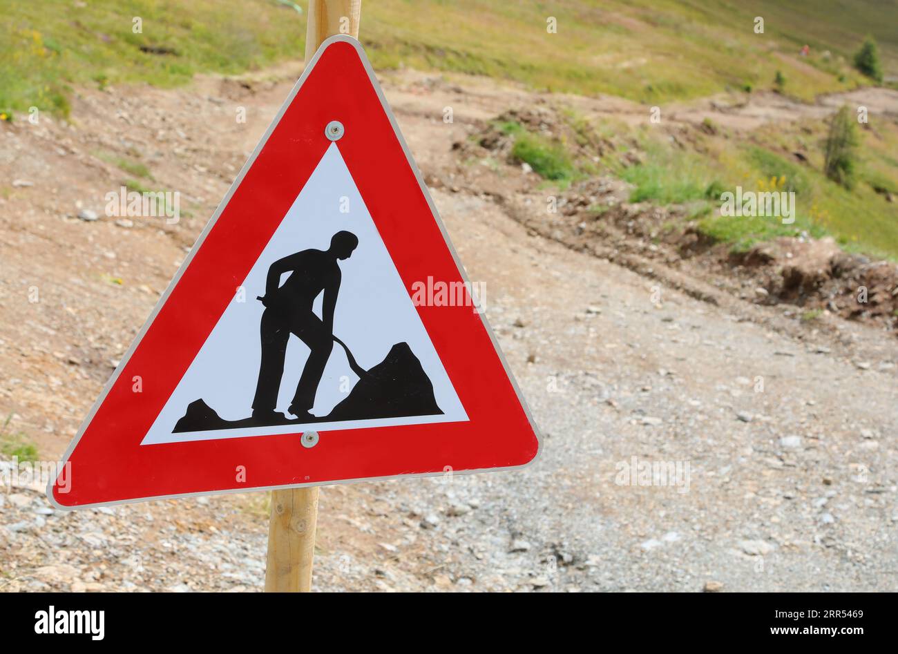 new traffic sign of work in progress in an outdoor construction site ...