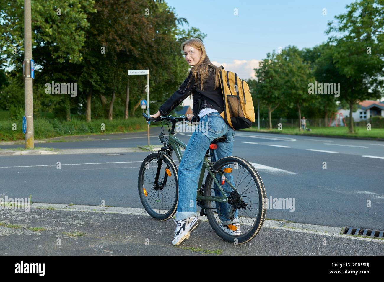 Portrait of teenage student girl with backpack on bicycle Stock Photo ...
