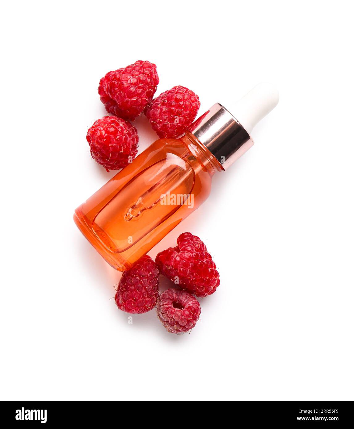 Bottle of cosmetic raspberry oil on white background Stock Photo - Alamy