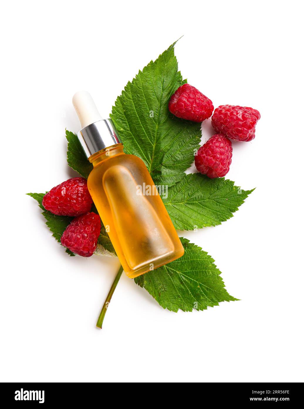 Bottle of cosmetic raspberry oil on white background Stock Photo - Alamy
