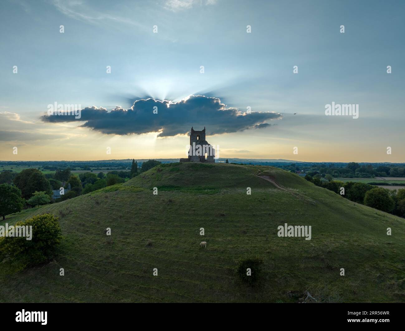 An aerial view of the picturesque Burrow Mump hill and historic site ...