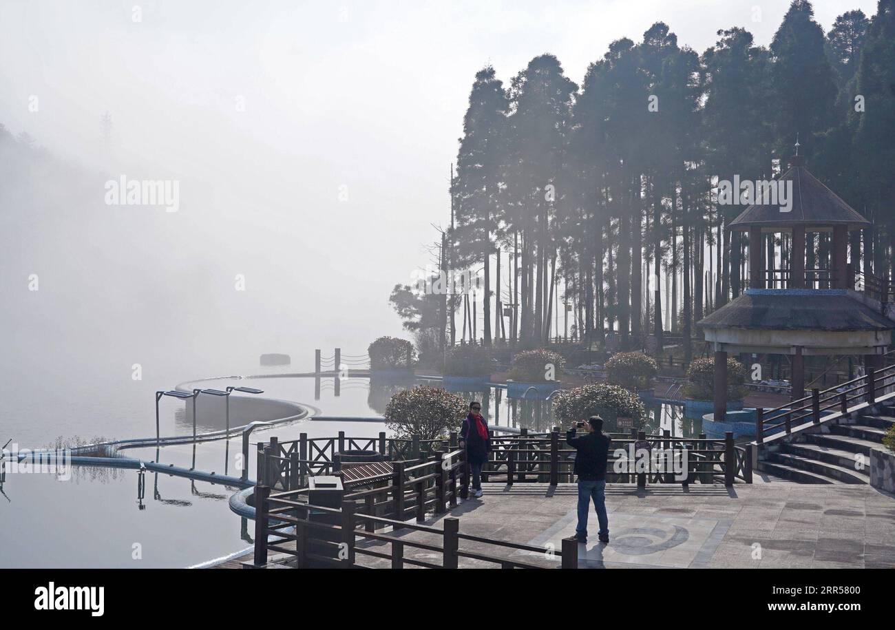 201225 -- YICHUN, Dec. 25, 2020 -- Visitors tour Yueliang Lake at ...
