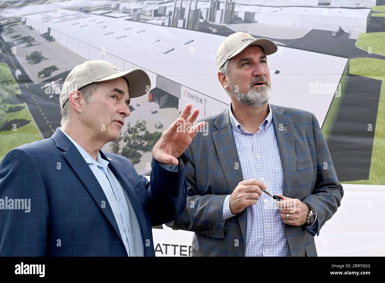 Larry Keith, CEO of ENTEK, points out one of the features in the artist ...