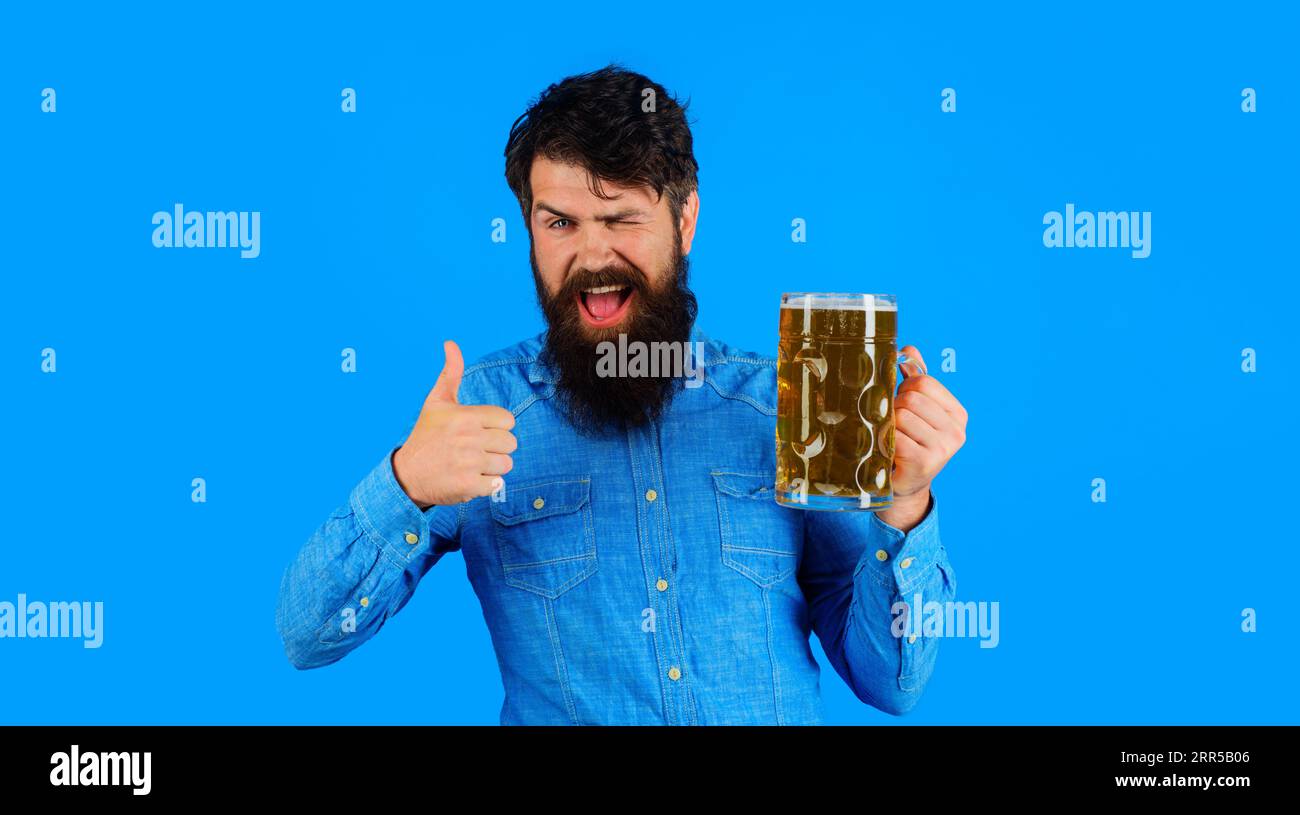 Beer degustation. Bearded man drinking beer from mug at bar or pub ...