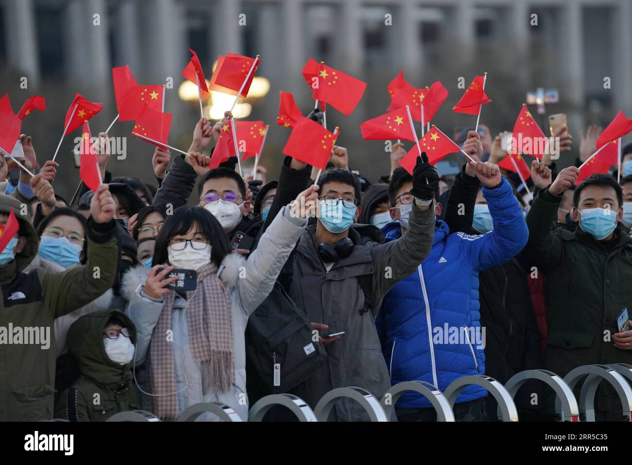 210101 -- BEIJING, Jan. 1, 2021 -- People wave Chinese national flags ...