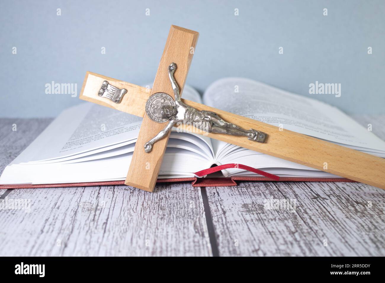 Beautiful Holy Bible on a wooden table against a bright white ...