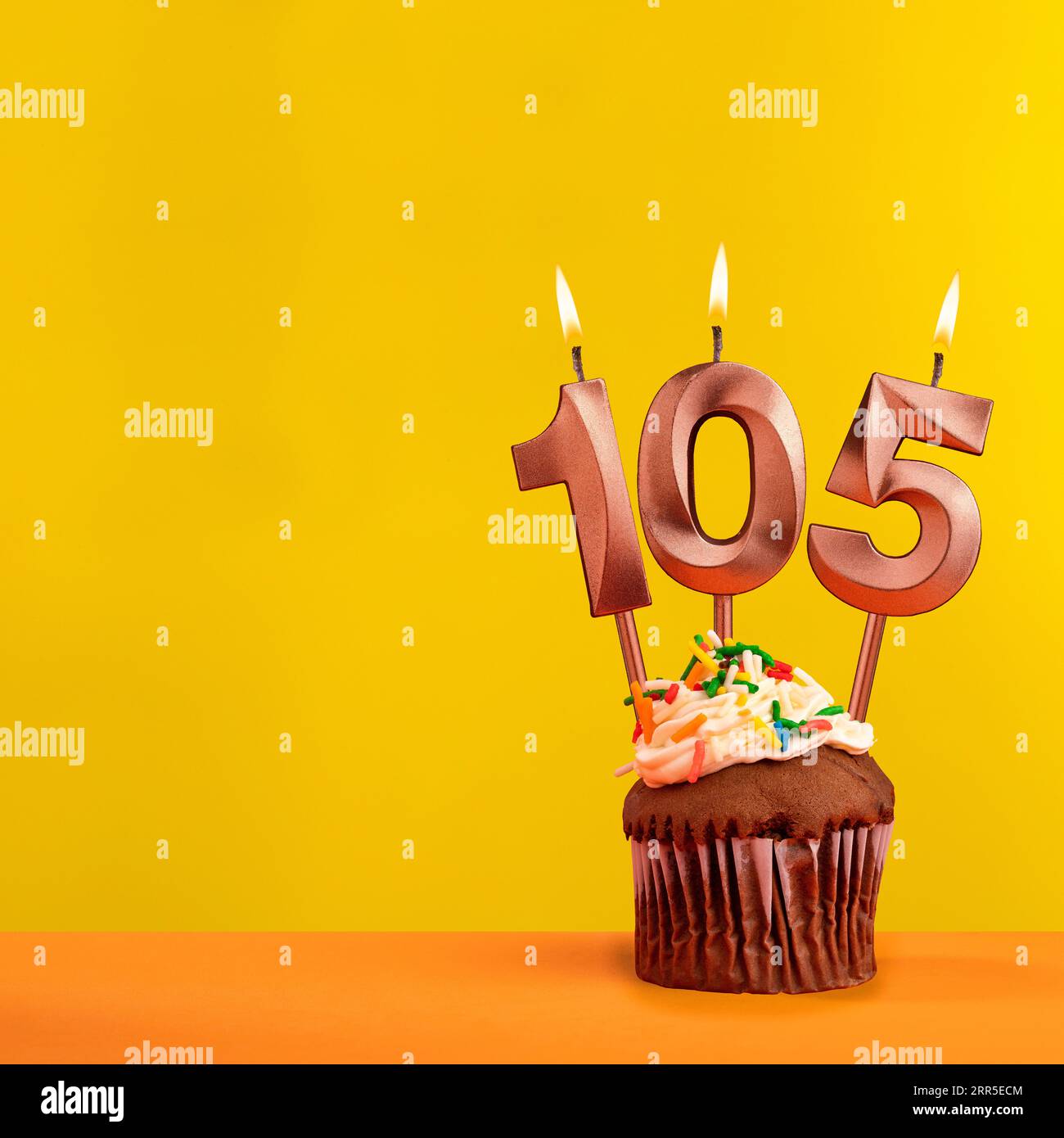 Candle with flame number 105 - Birthday card on yellow background Stock ...