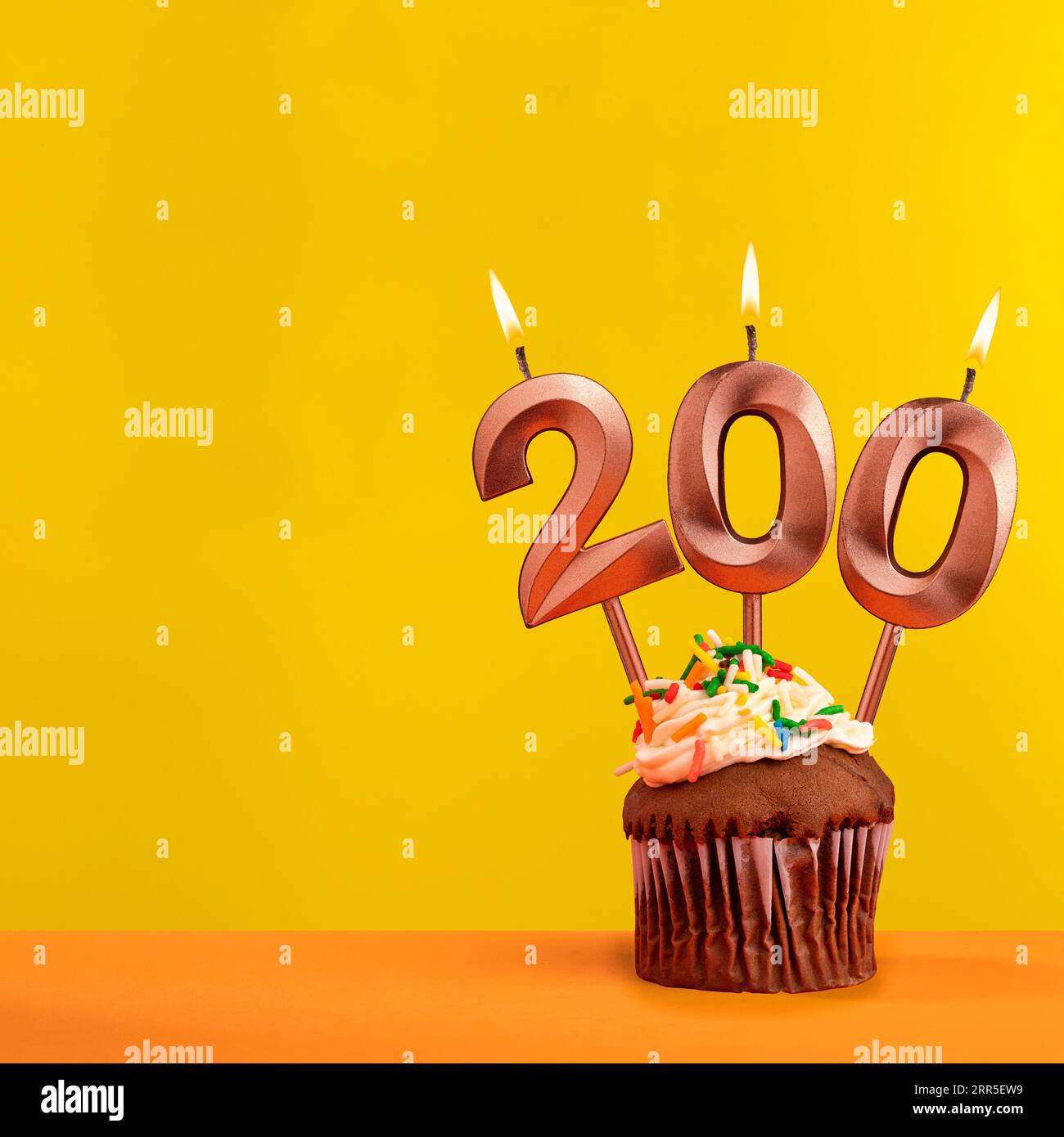 Candle with flame number 200 - Anniversary card on yellow background ...