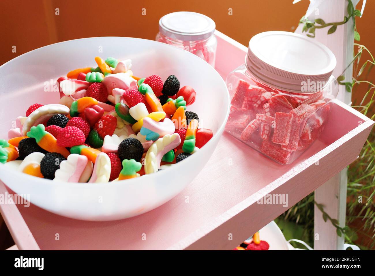 table with lots of sweets in containers for a party Stock Photo - Alamy