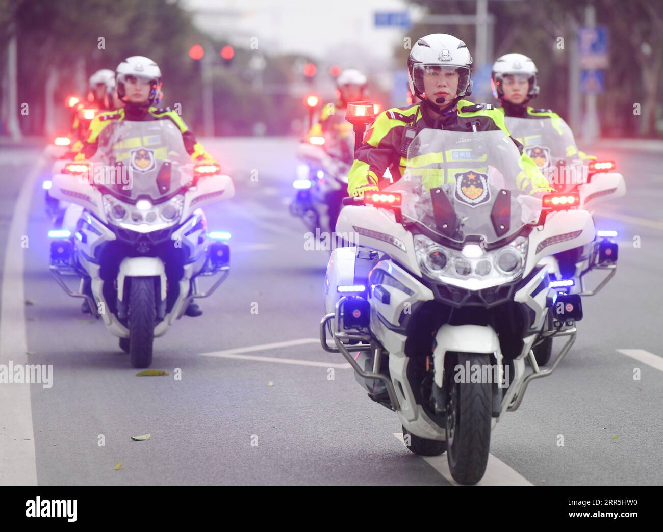 210108 -- FUZHOU, Jan. 8, 2021 -- Traffic policewomen driving ...