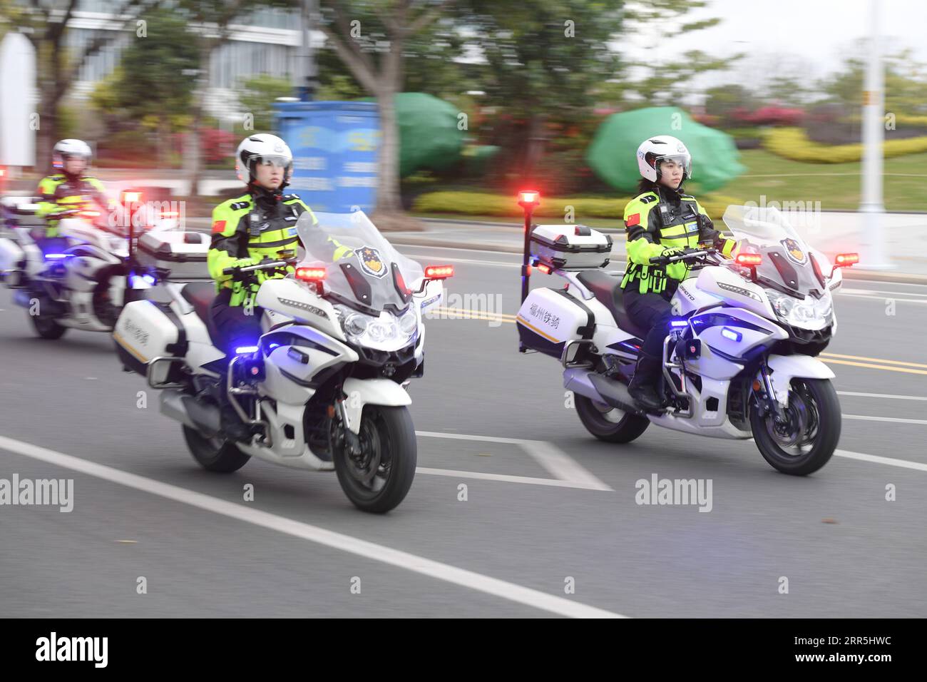 210108 -- FUZHOU, Jan. 8, 2021 -- Traffic policewomen driving ...