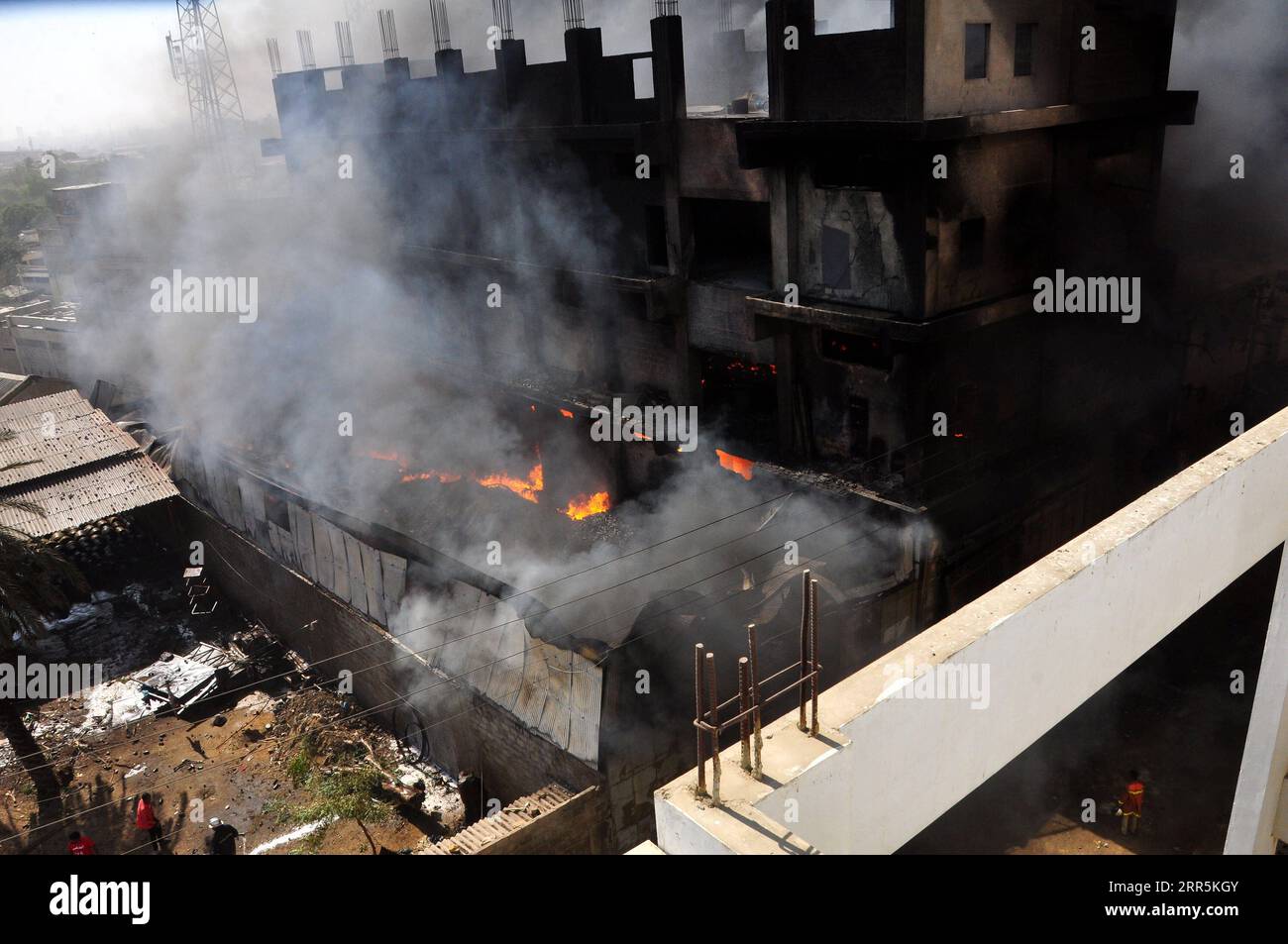 210110 -- KARACHI, Jan. 10, 2021 -- Fire rages through a factory in ...