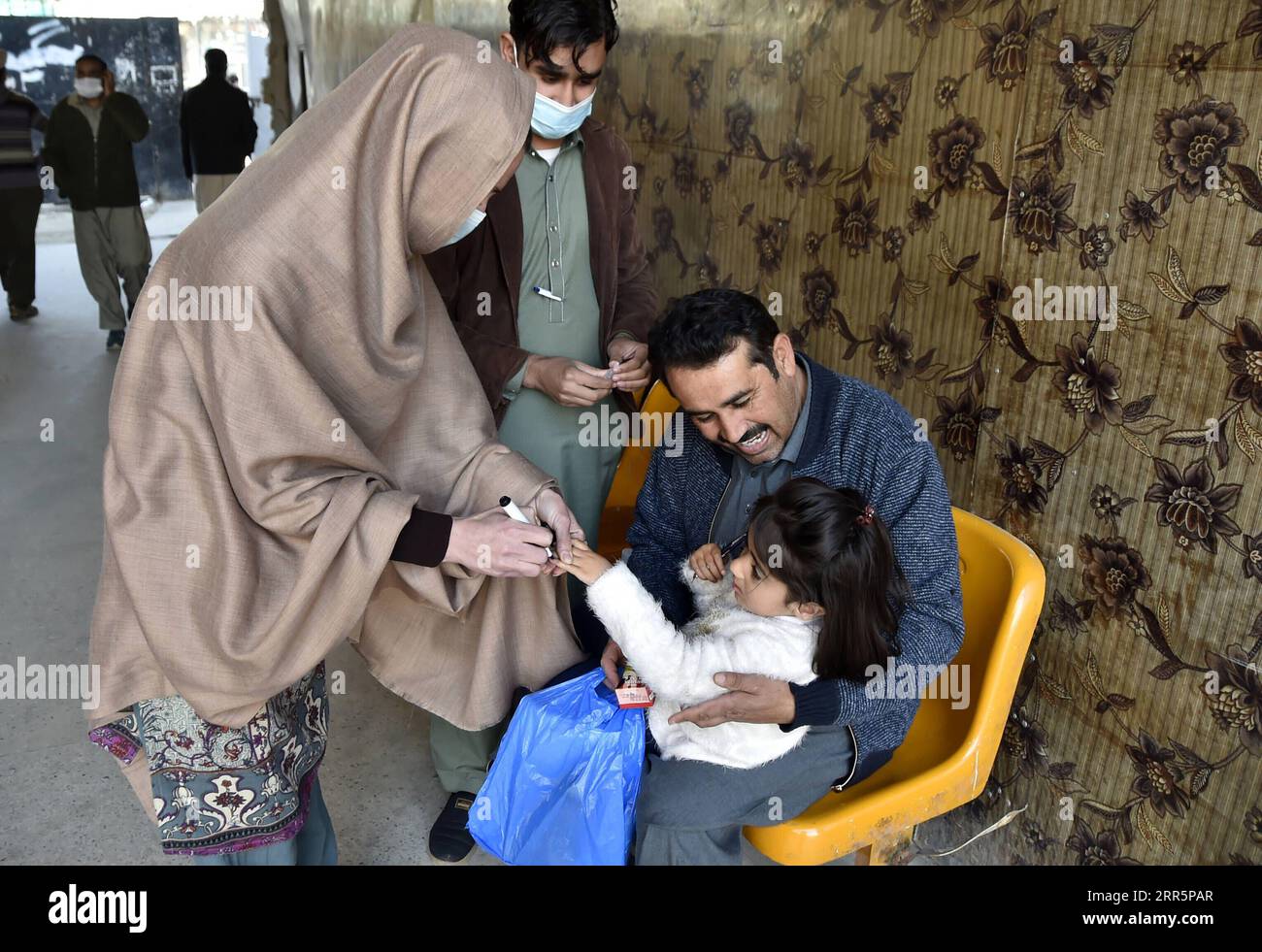 210112 -- PESHAWAR PAKISTAN, Jan. 12, 2021 -- A child s finger is ...