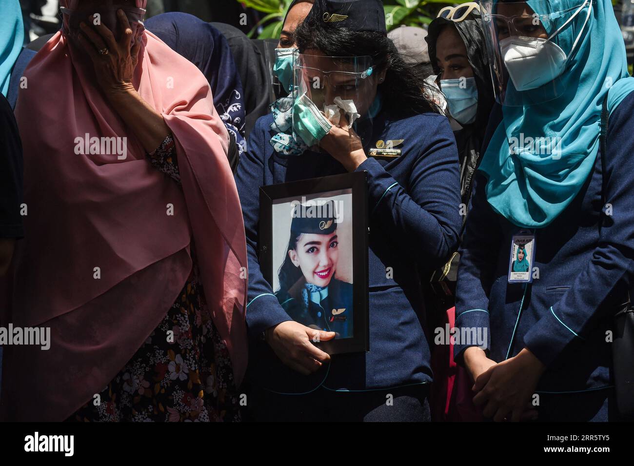 210116 -- WEST JAVA, Jan. 16, 2021 -- A stewardess weeps during a ...