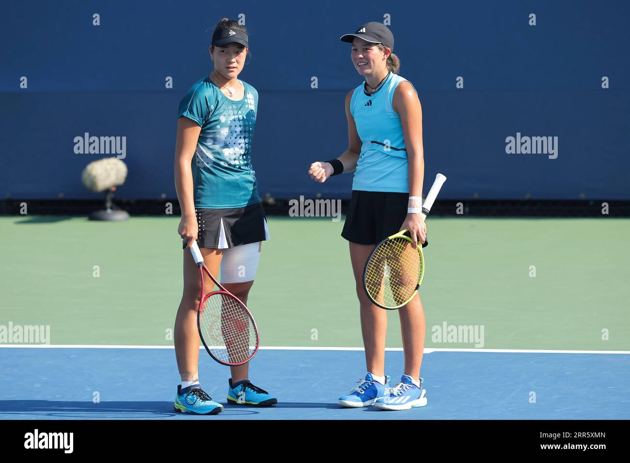 Ena Koike and Sayaka Ishii in action during a junior girls' doubles ...