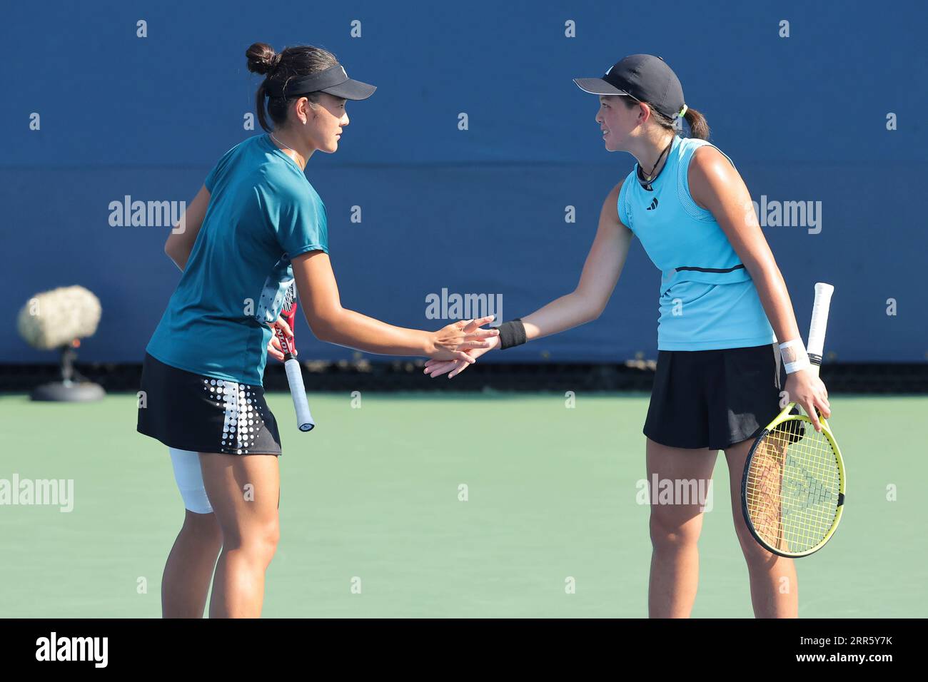 Ena Koike and Sayaka Ishii in action during a junior girls' doubles ...