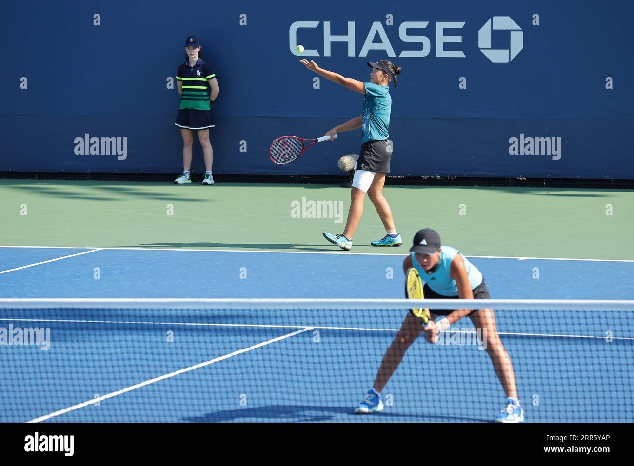 Ena Koike and Sayaka Ishii in action during a junior girls' doubles ...