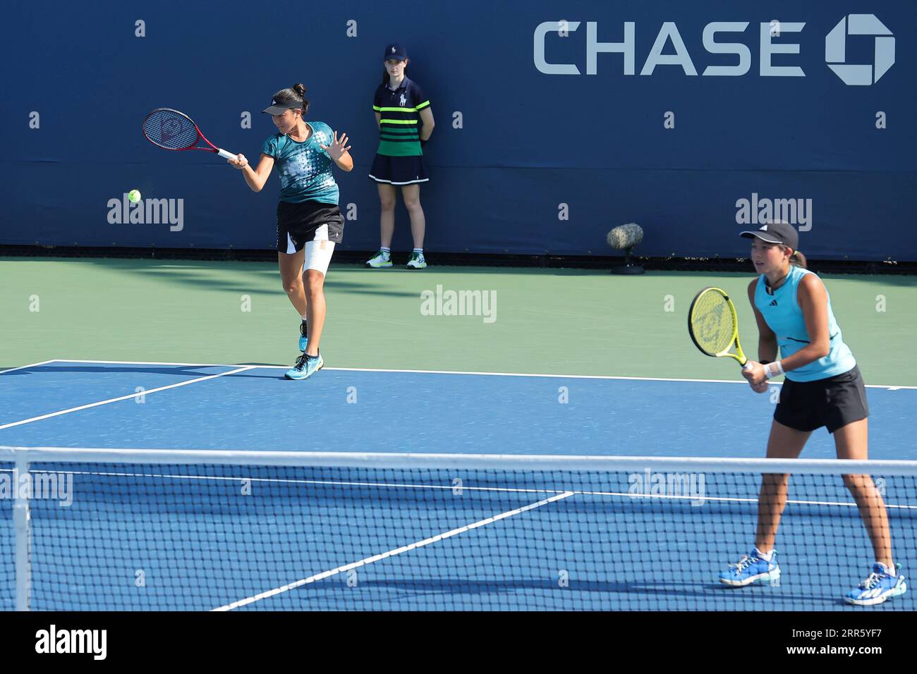Ena Koike and Sayaka Ishii in action during a junior girls' doubles ...