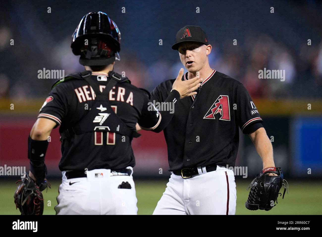 Arizona Diamondbacks relief pitcher Scott McGough, right, celebrates ...