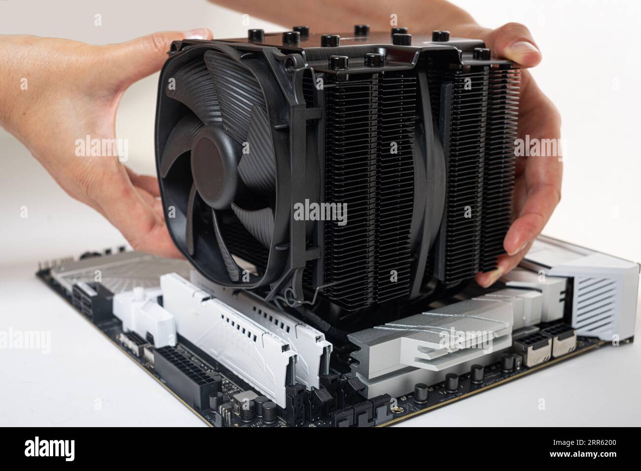 Installing a large cooler on a computer processor Stock Photo - Alamy