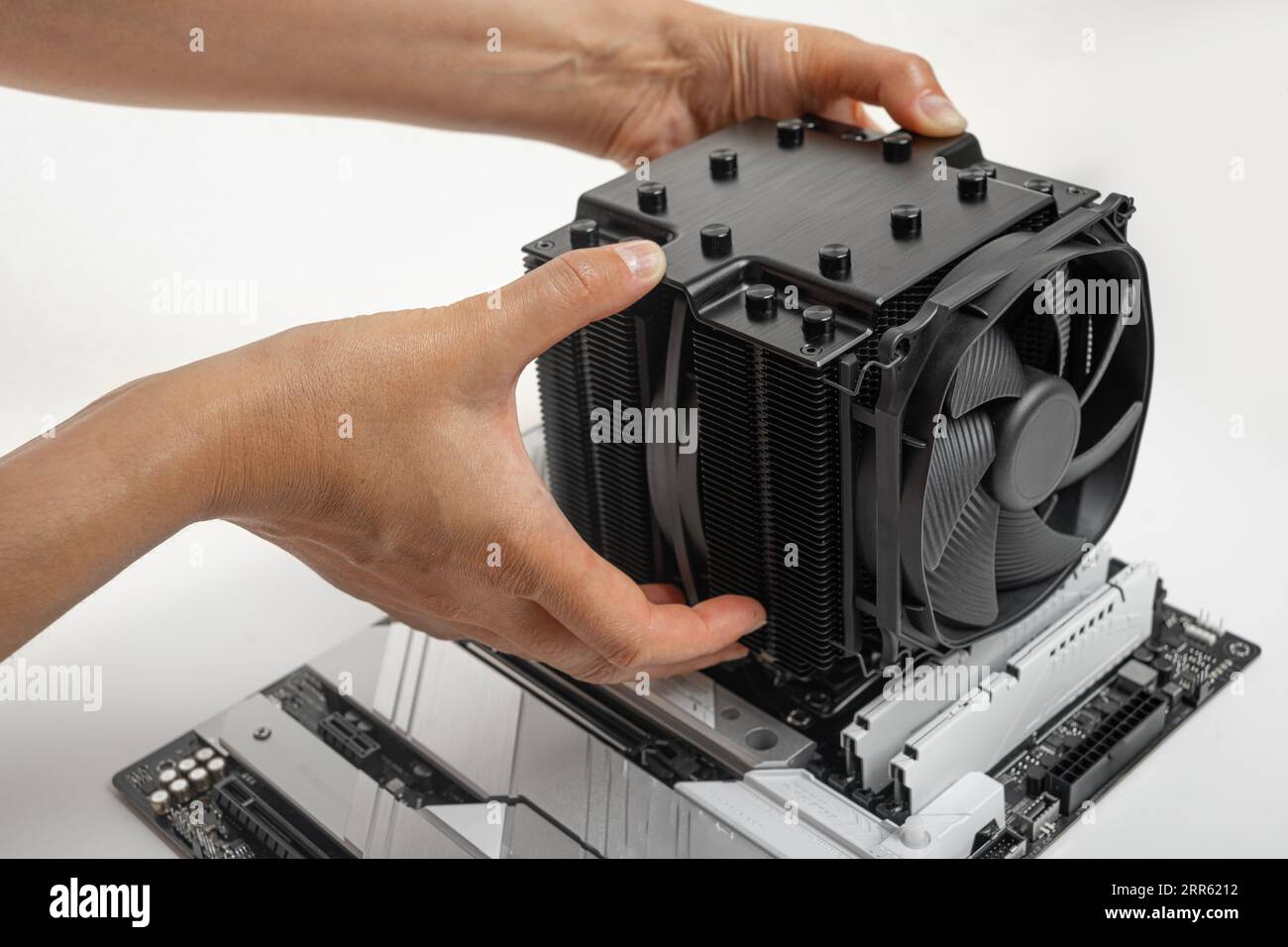 Installing a large cooler on a computer processor Stock Photo - Alamy