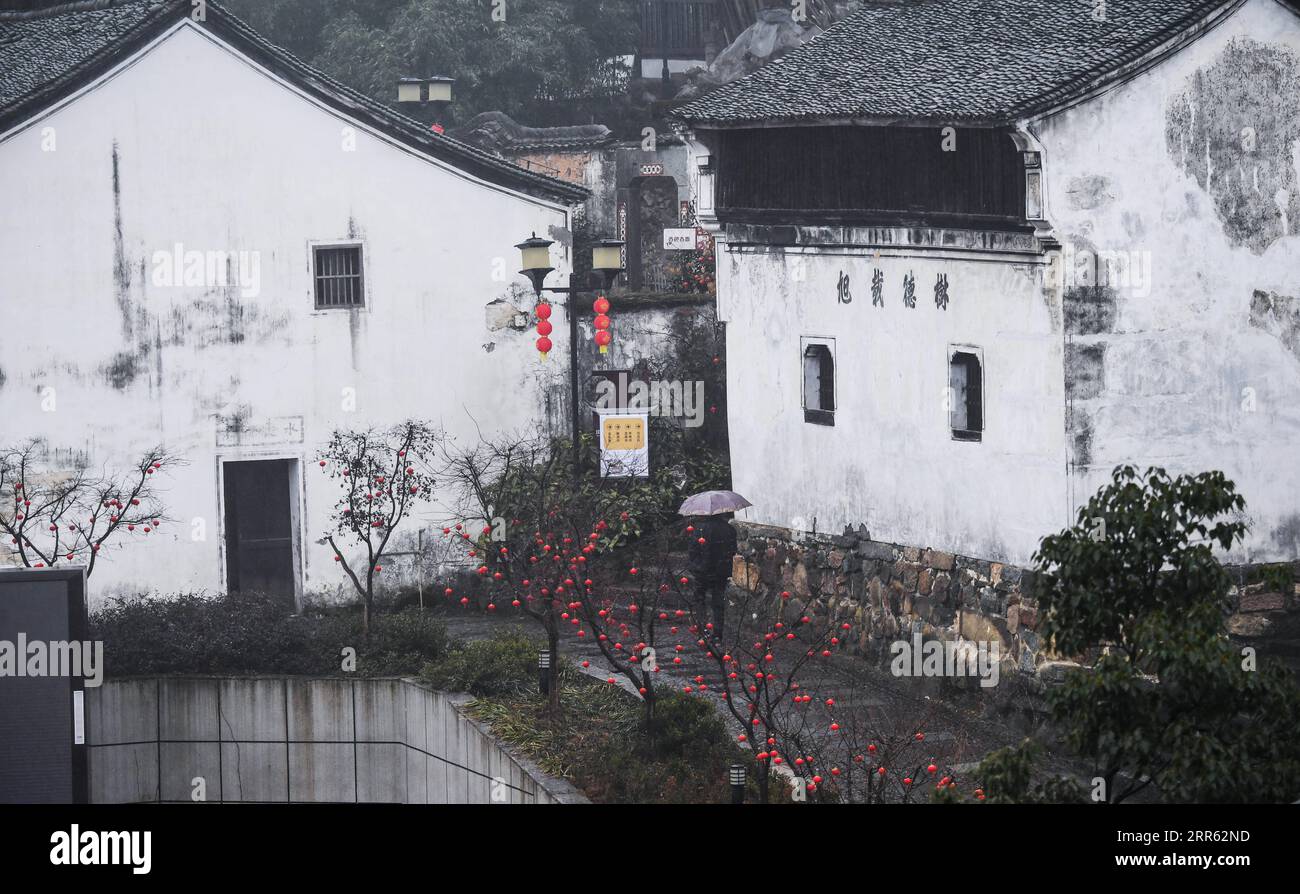 210123 -- HANGZHOU, Jan. 23, 2021 -- A visitor walks in the ancient ...