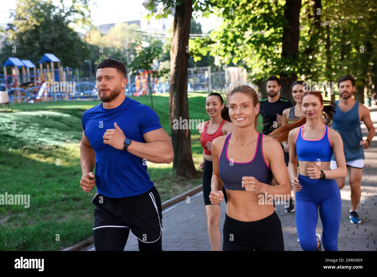 Group of people running in park. Active lifestyle Stock Photo - Alamy