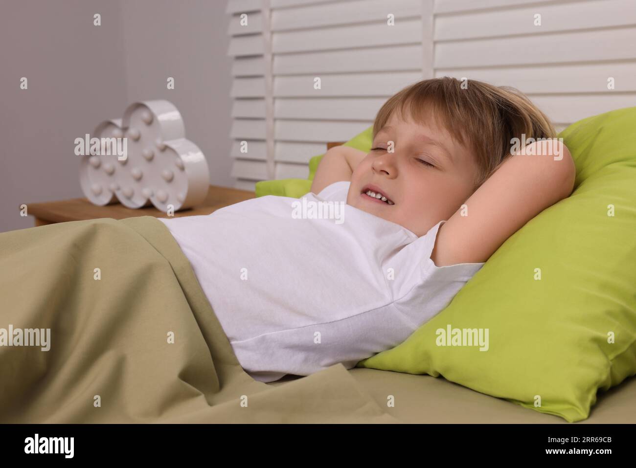 Little boy snoring while sleeping in bed indoors Stock Photo - Alamy