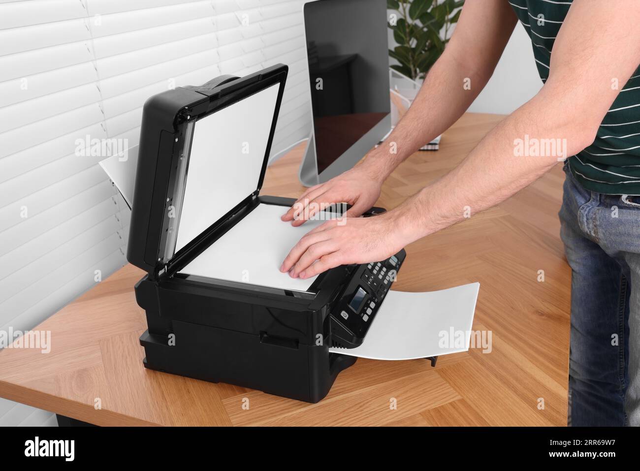 Person using black printer at home hi-res stock photography and images ...