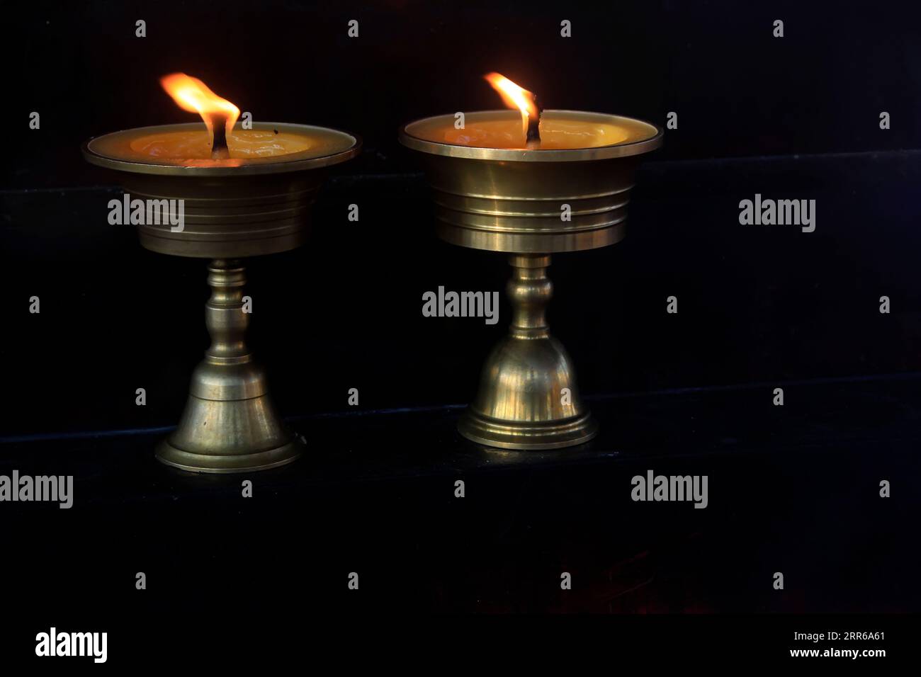 butter lamp in black background, closeup of photo Stock Photo - Alamy