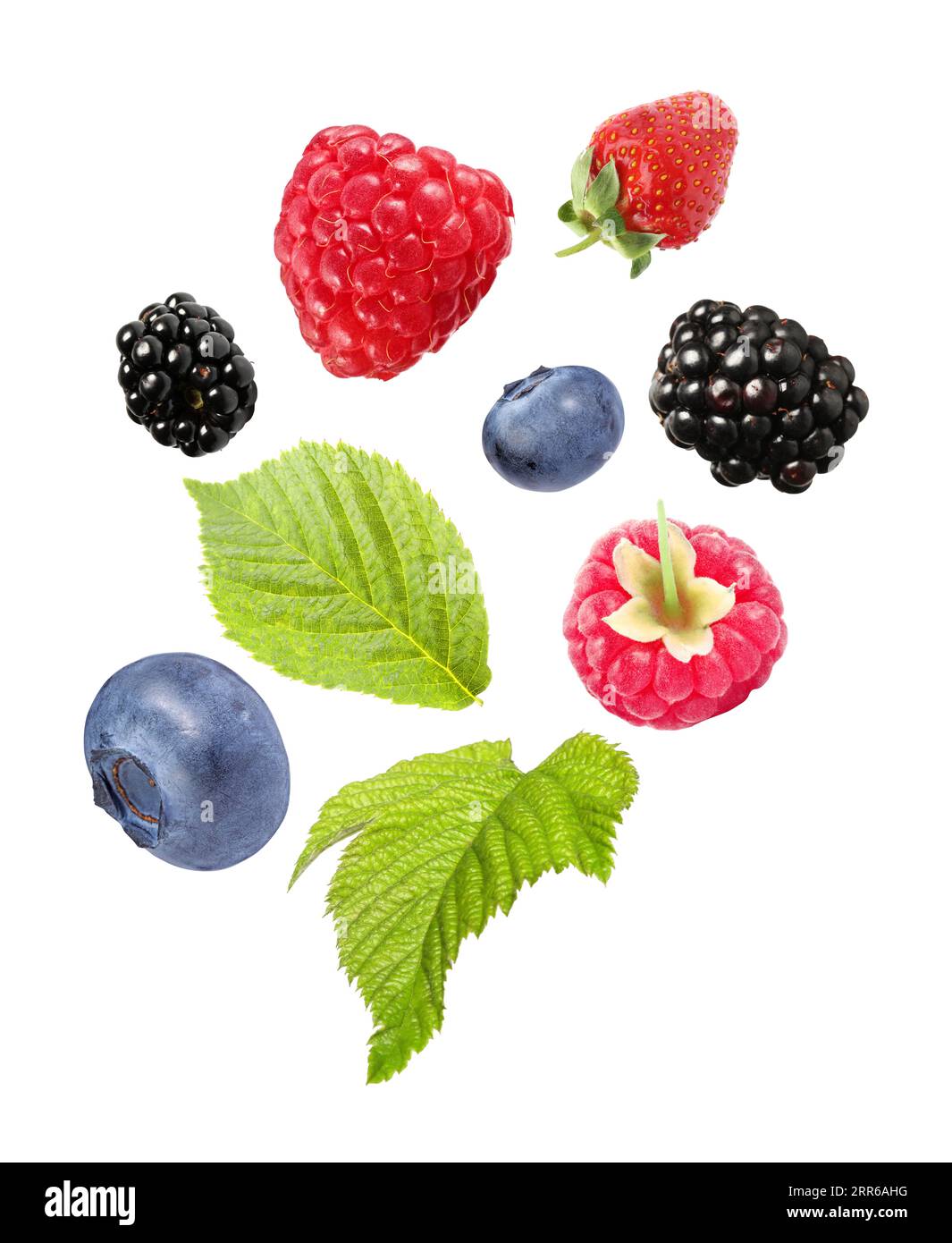 Many different berries flying on white background Stock Photo - Alamy