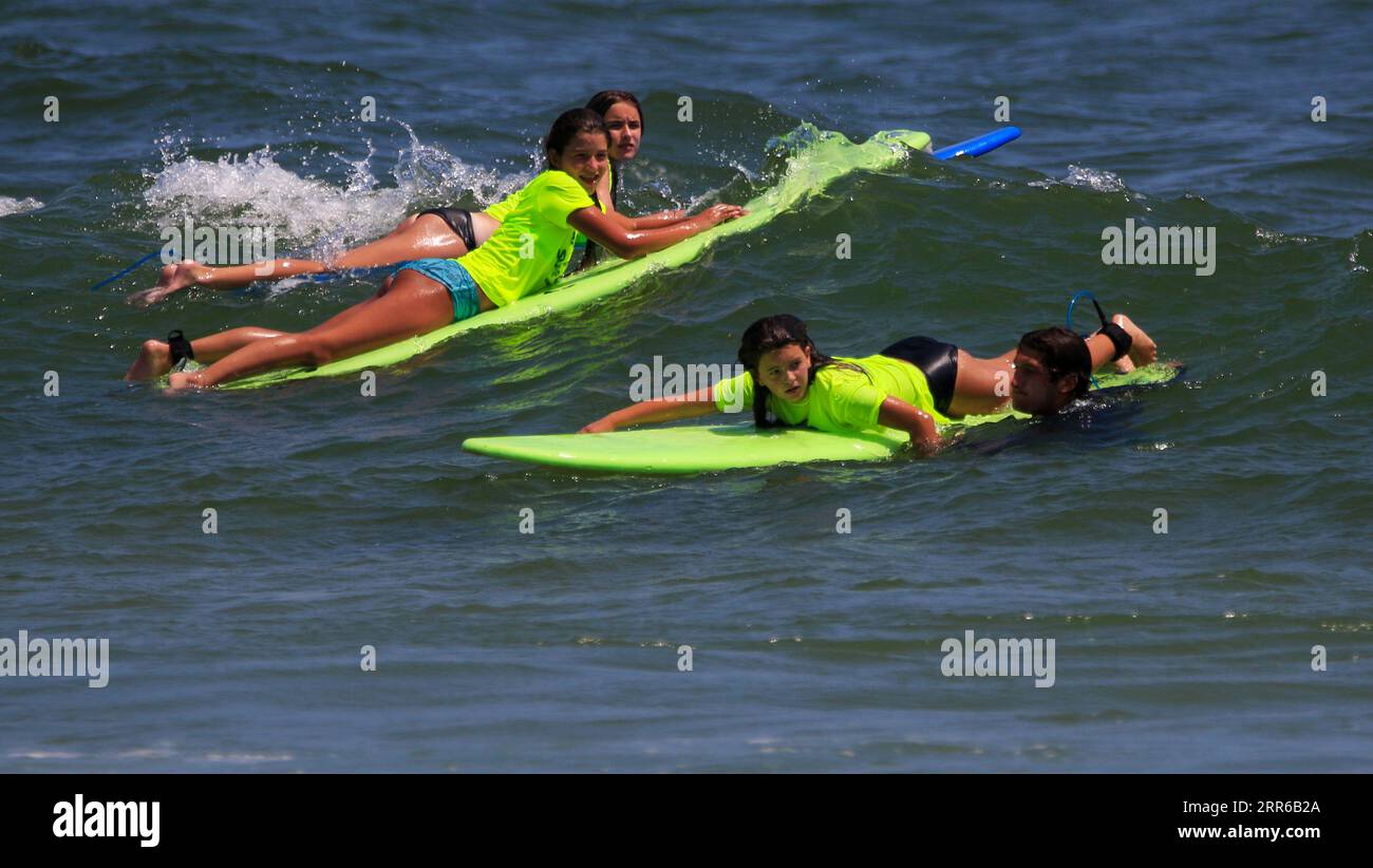 Kids riding on beach hi-res stock photography and images - Alamy