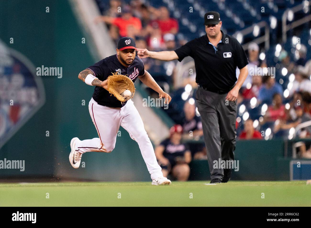 Washington Nationals first baseman Dominic Smith fields a ball hit by ...