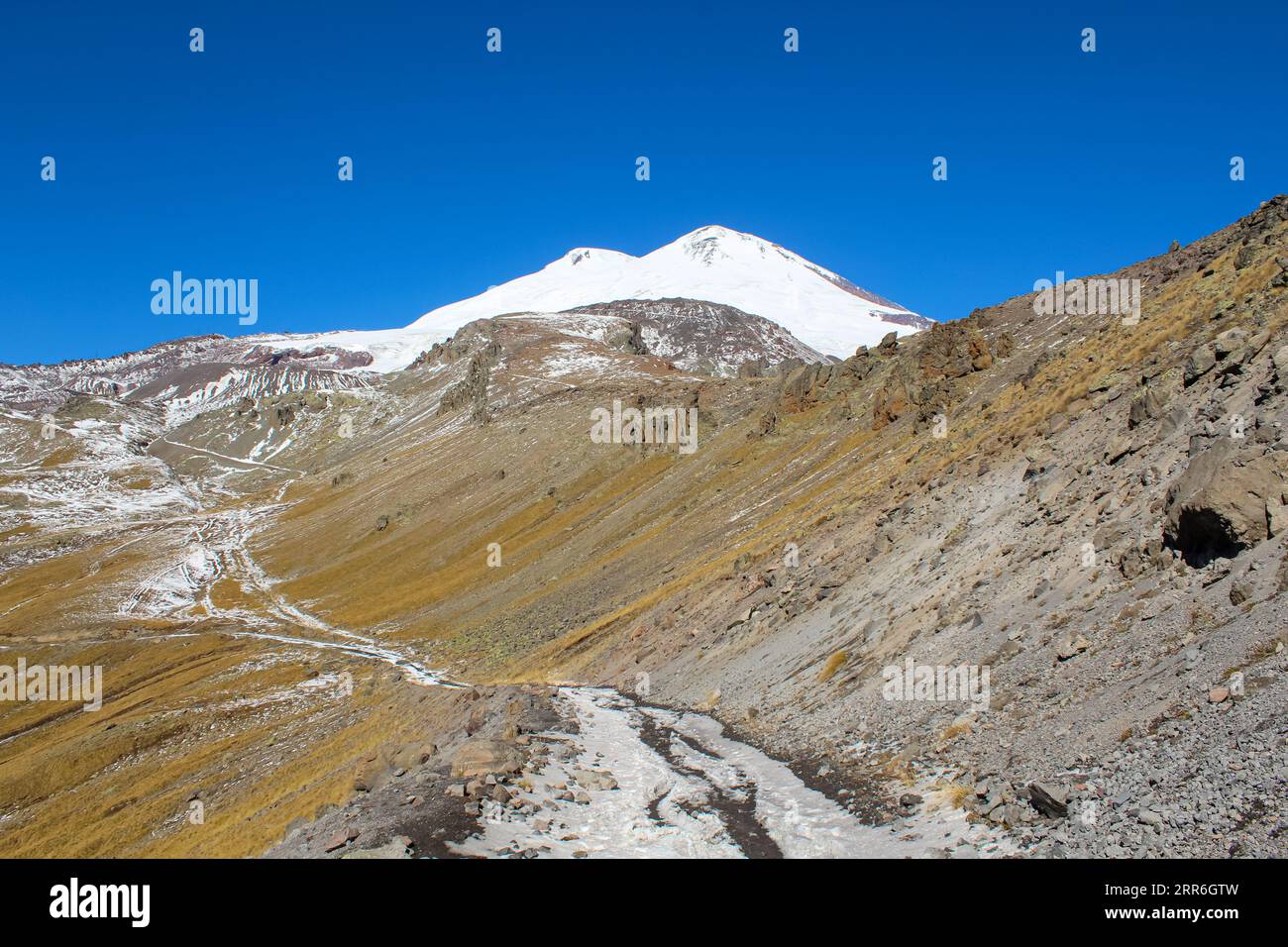 Double peak of Mount Elbrus, the highest mountain in Europe, blue sky ...