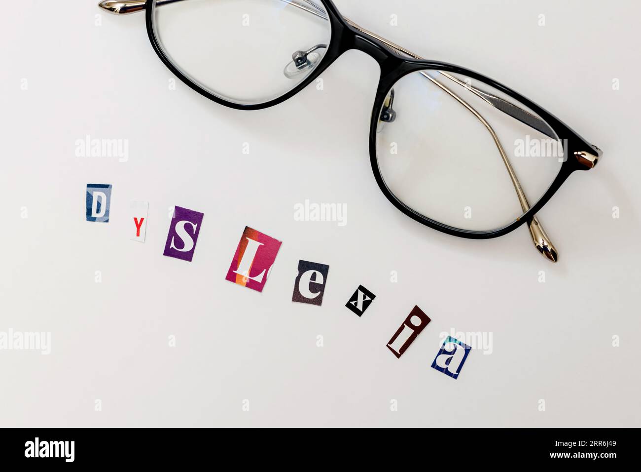 Dyslexia disorder concept, word spelled in colorful paper cut letters ...
