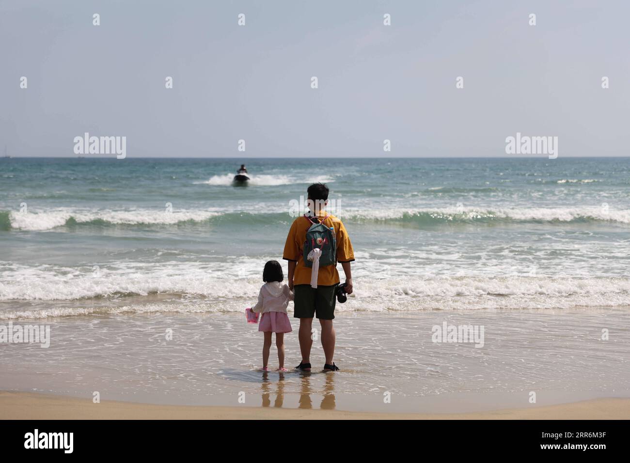 210221 -- WANNING, Feb. 21, 2021 -- People spend time on the beach in ...