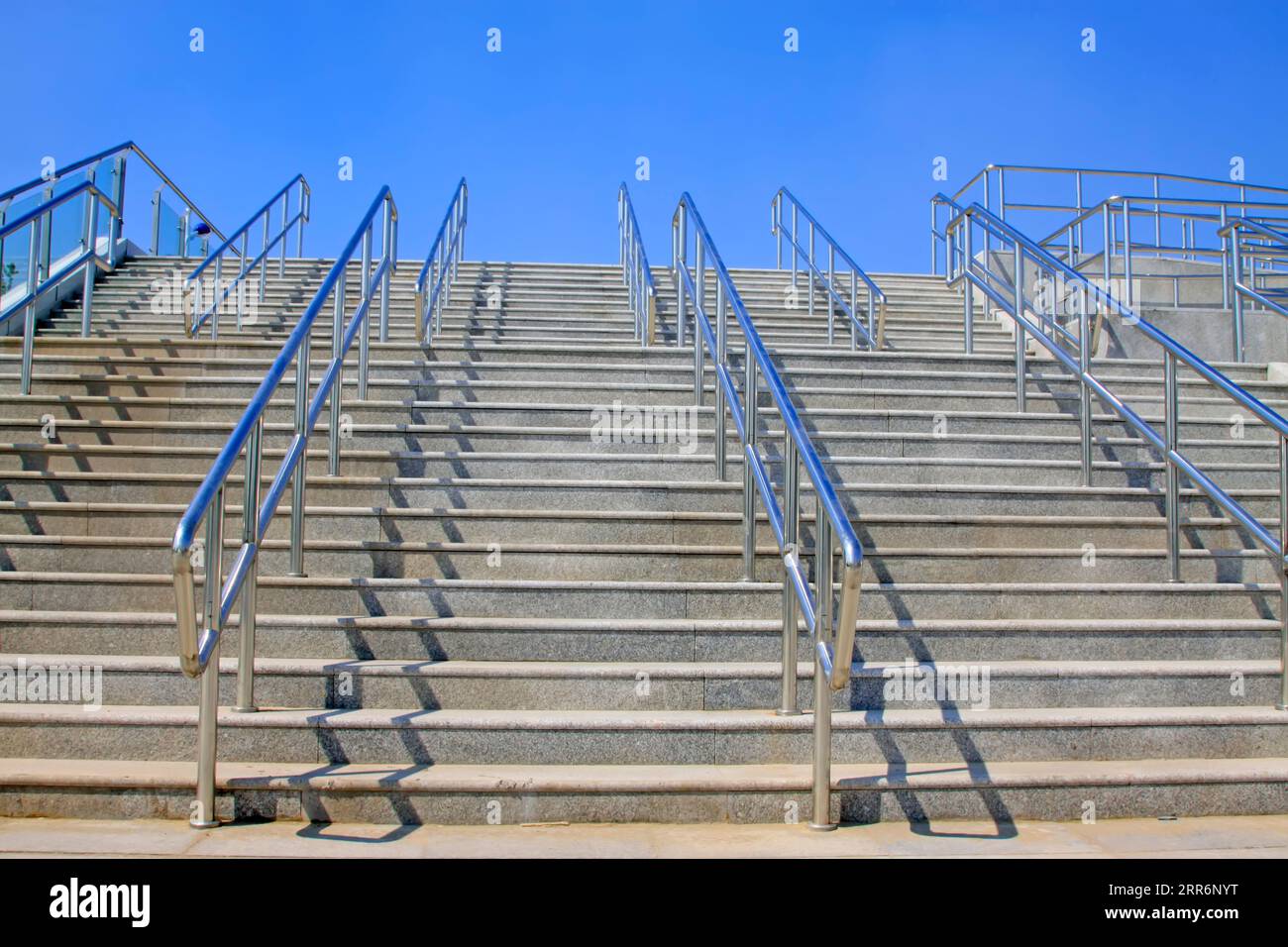 Stainless steel handrails and steps in a building Stock Photo - Alamy
