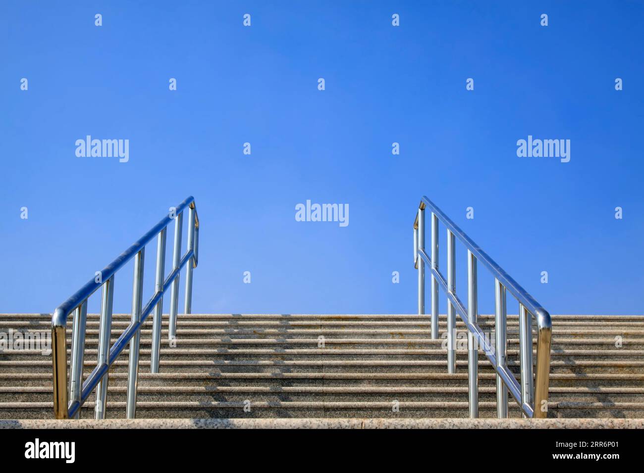 Stainless steel handrails and steps in a building Stock Photo - Alamy